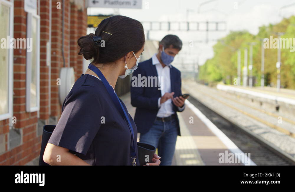Nurse On Railway Platform Wearing PPE Face Mask Commuting To Work ...