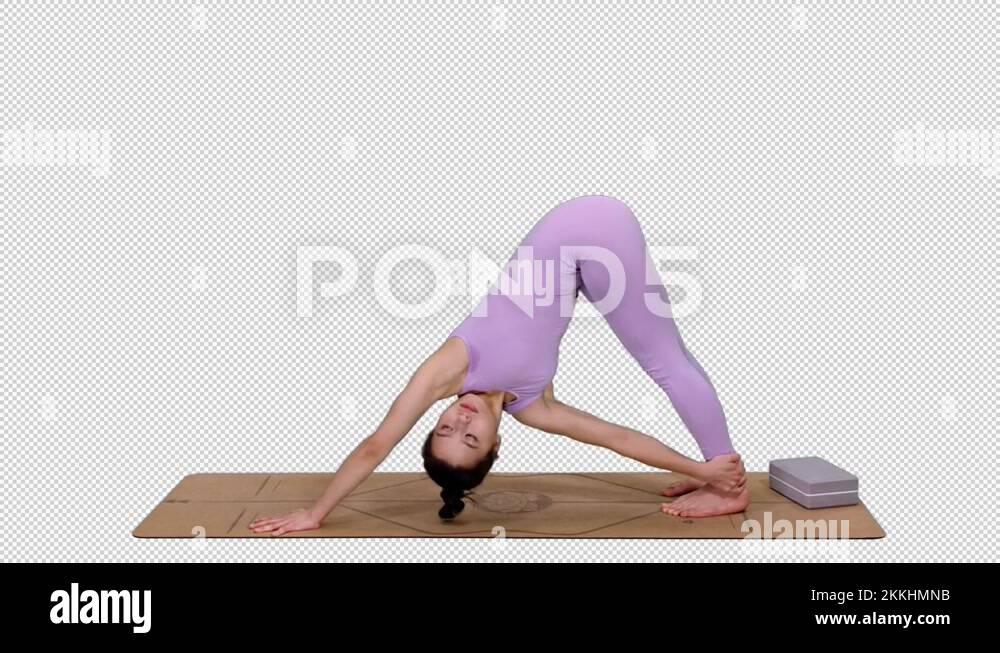 Flexible woman doing yoga triangle posture and Downward Facing Dog pose ...