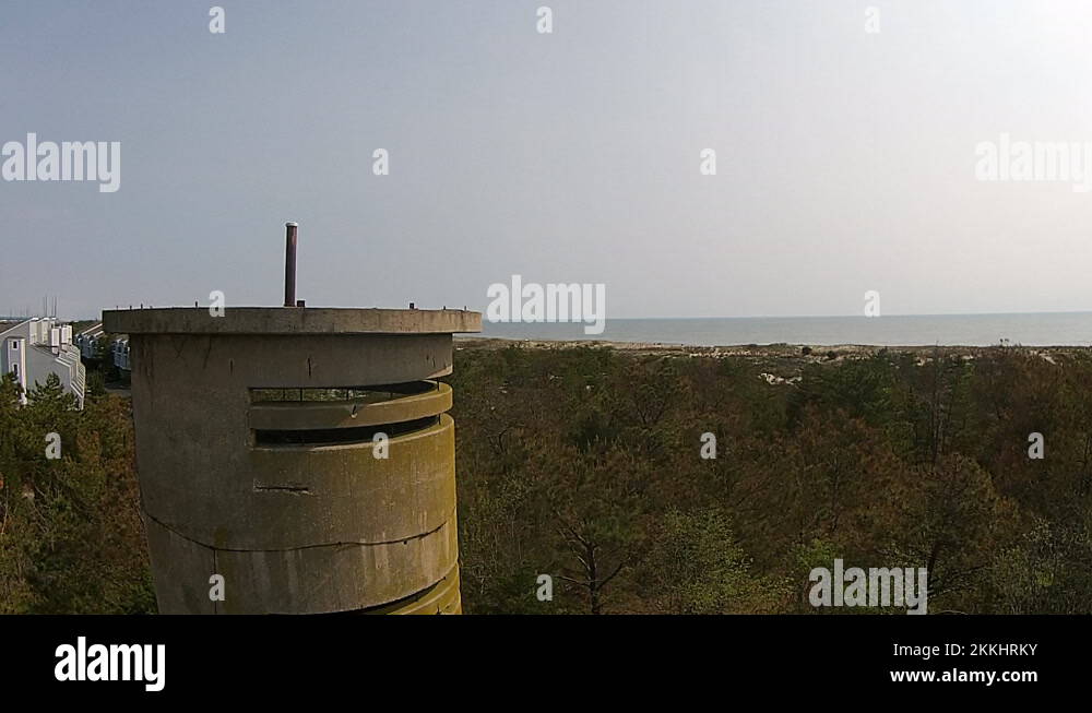 Drone shot rises past World War II watchtower to reveal view of ocean ...