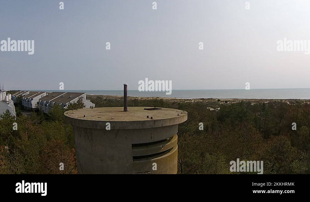 Drone shot rises above World War II watchtower to view of Atlantic ...