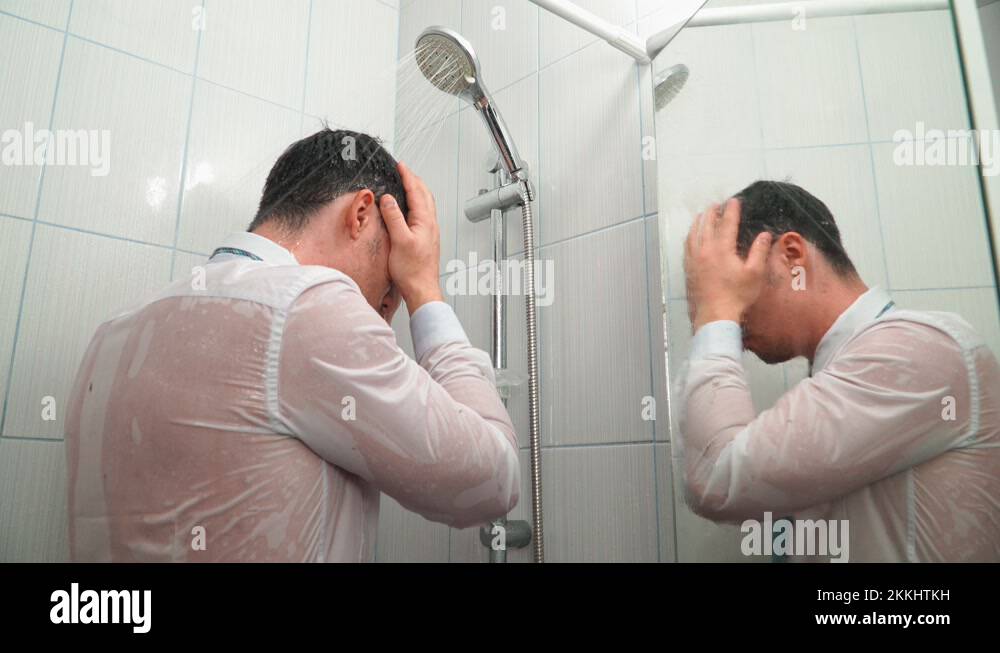 Sad Man in Shirt and Tie Stands in Bathroom under Shower and Bathes in ...