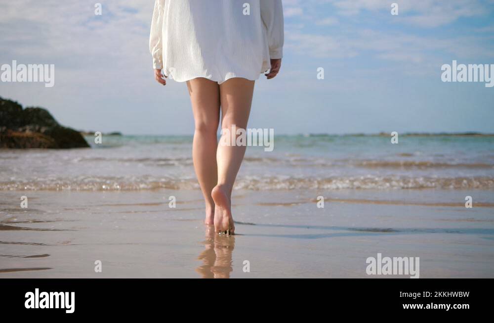 Slow motion inspired woman feet walking barefoot on beach Stock Video ...