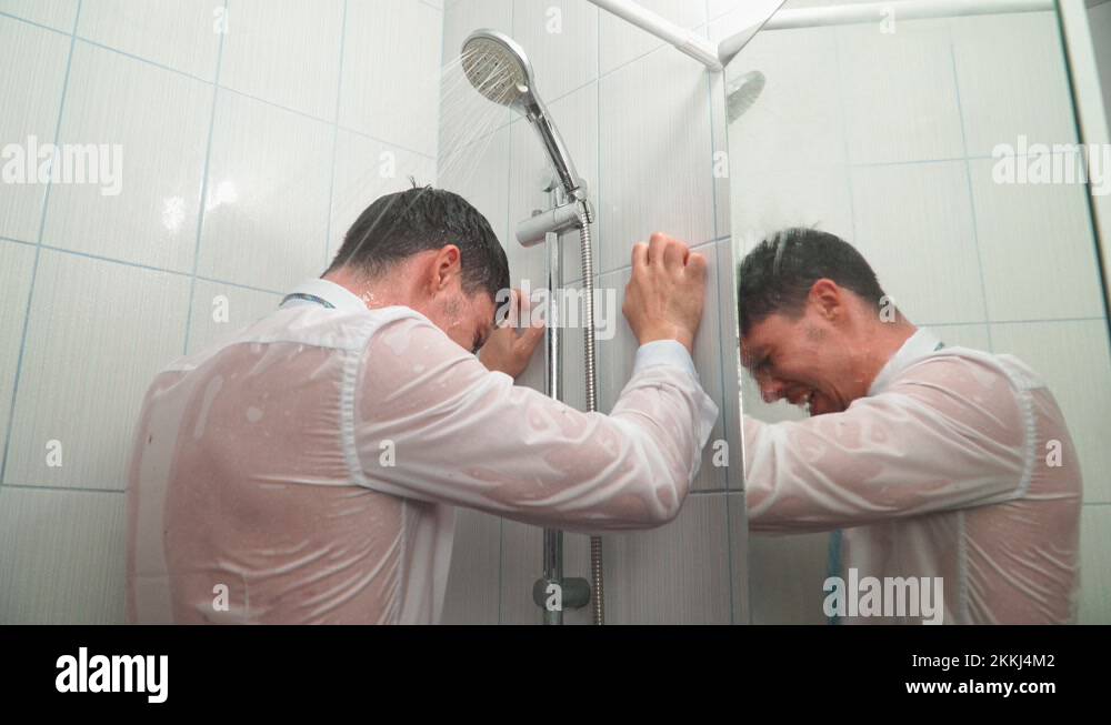 Sad Man in Shirt and Tie Stands in Bathroom under Shower and Bathes in ...
