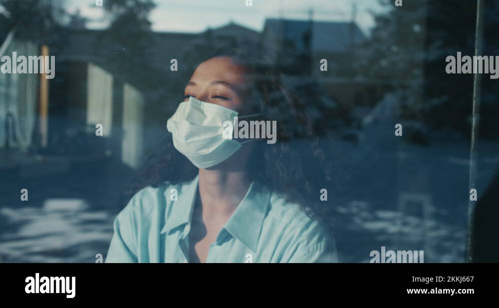 Life on self-isolation. Portrait of young beautiful mixed race woman in ...