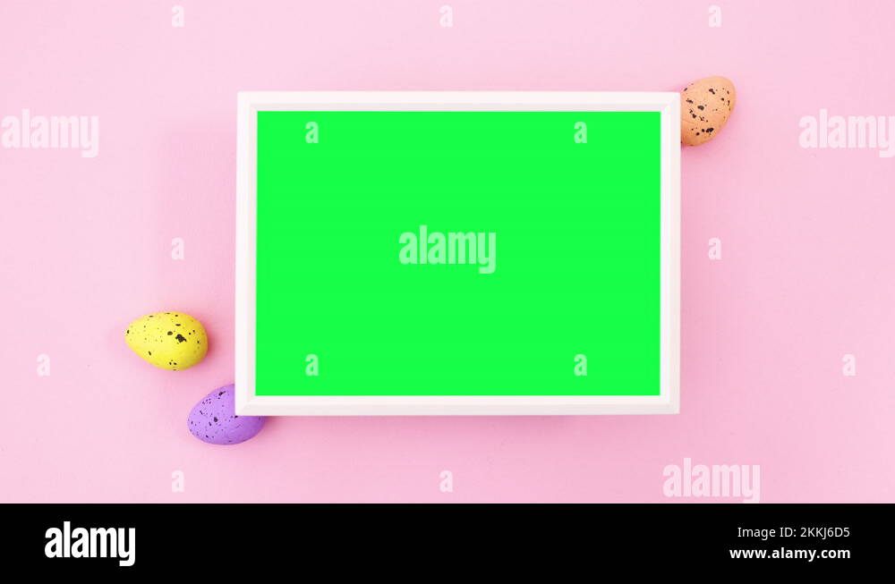 Easter eggs and frame with green screen on pink theme. Stop motion ...