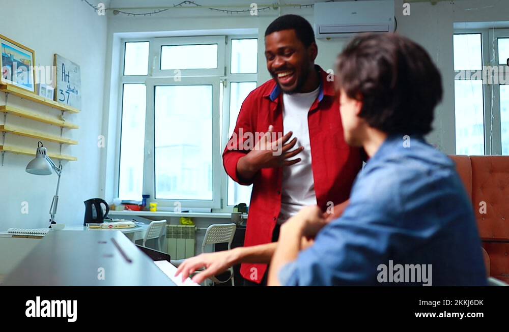Teacher Practicing Vocal Cords With Man In Class Day Time Stock Video Footage Alamy