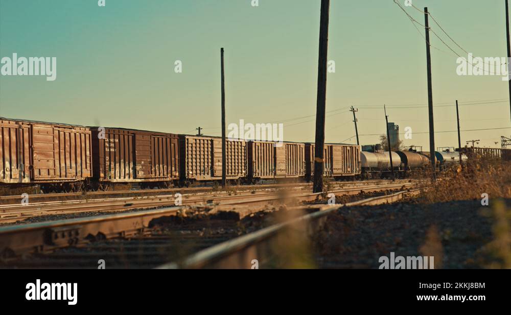Freight Train Cargo Cars Coming to a Stop at Empty Abandoned Industrial ...