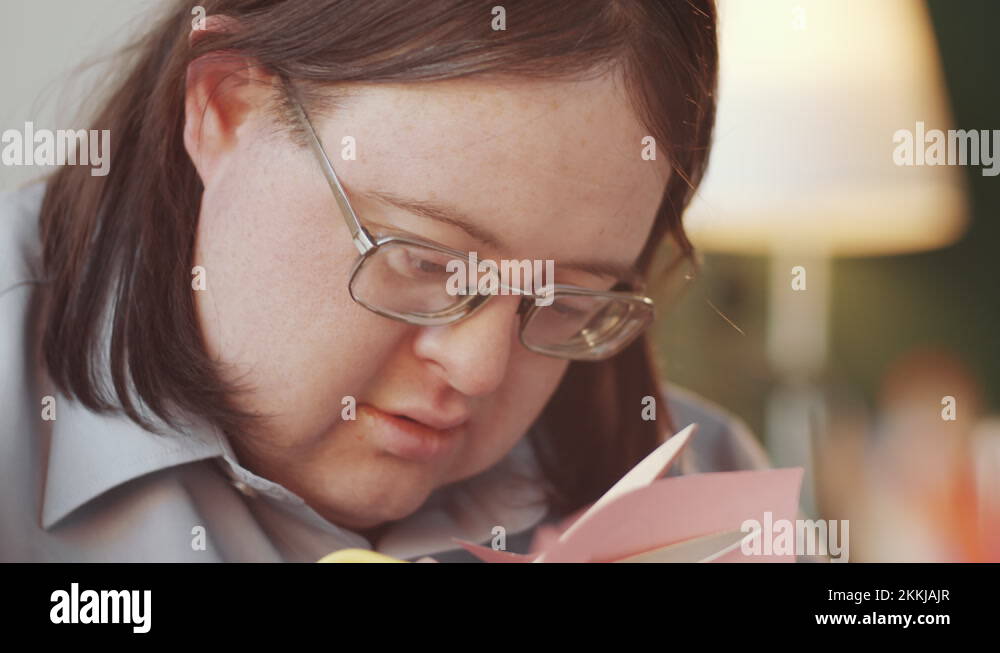 Man with Down Syndrome Cutting Paper while Doing Crafts Stock Video ...
