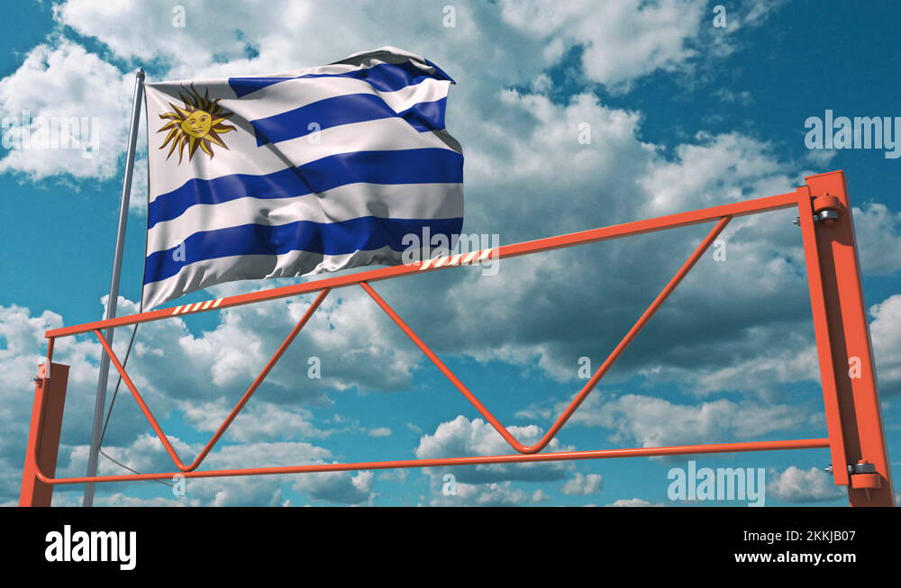 Manual swing arm road barrier and flag of Uruguay. Restricted entry ...