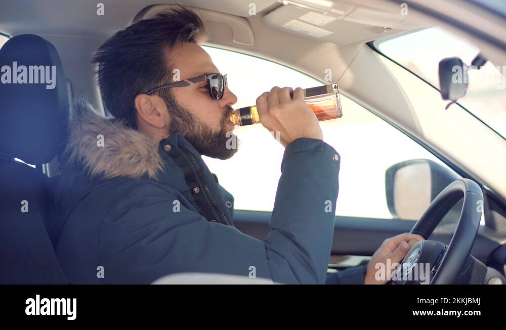 Drunk Driving On Road.Risk Car Accident.Drunk Driving Alcohol Bottle In ...