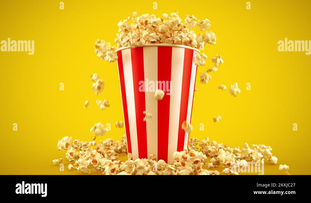 Popcorn falling out of a red-white striped bucket on a yellow ...