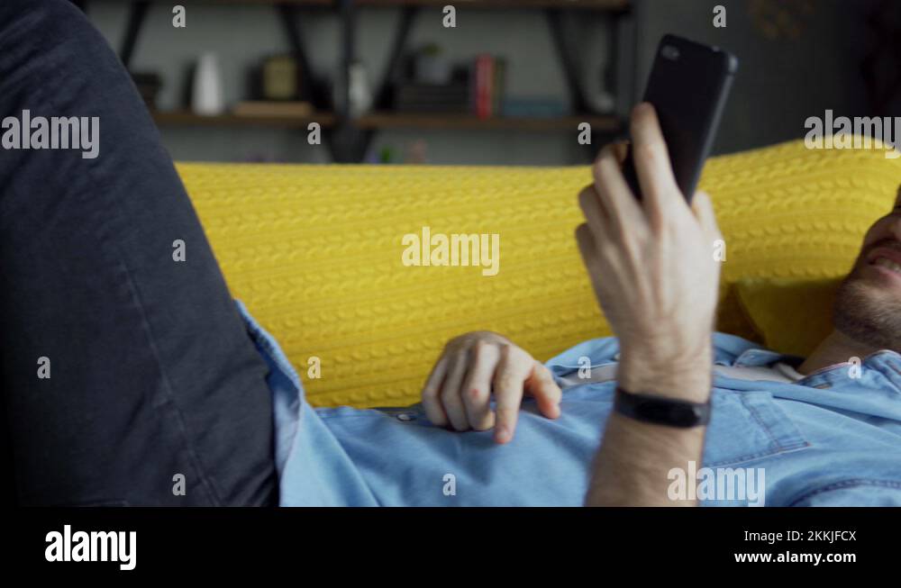 Man lying on sofa texting Stock Videos & Footage - HD and 4K Video ...