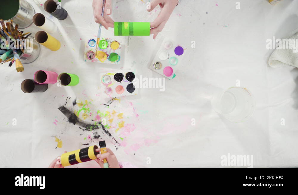 Painting empty toilet paper rolls with acrylic paint to create paper ...