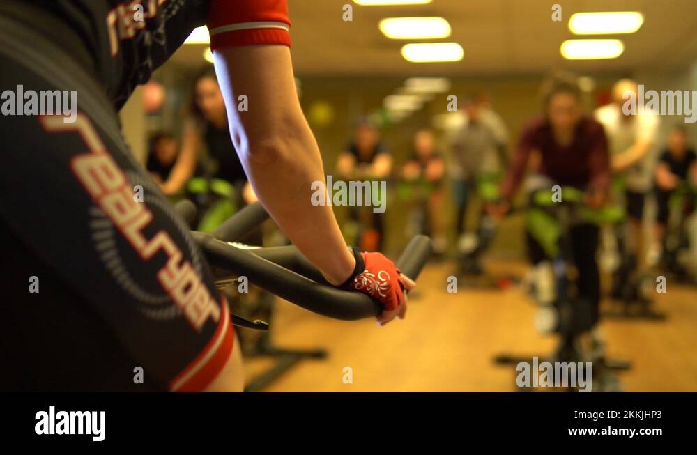 RUSSIA, MOSCOW - Feb 18, 2021 exercise bike competition workout female ...