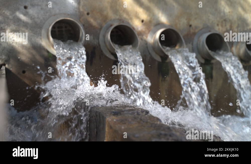 Clear Water Flows Through Row of Drain Pipes - Slow Motion Stock Video ...