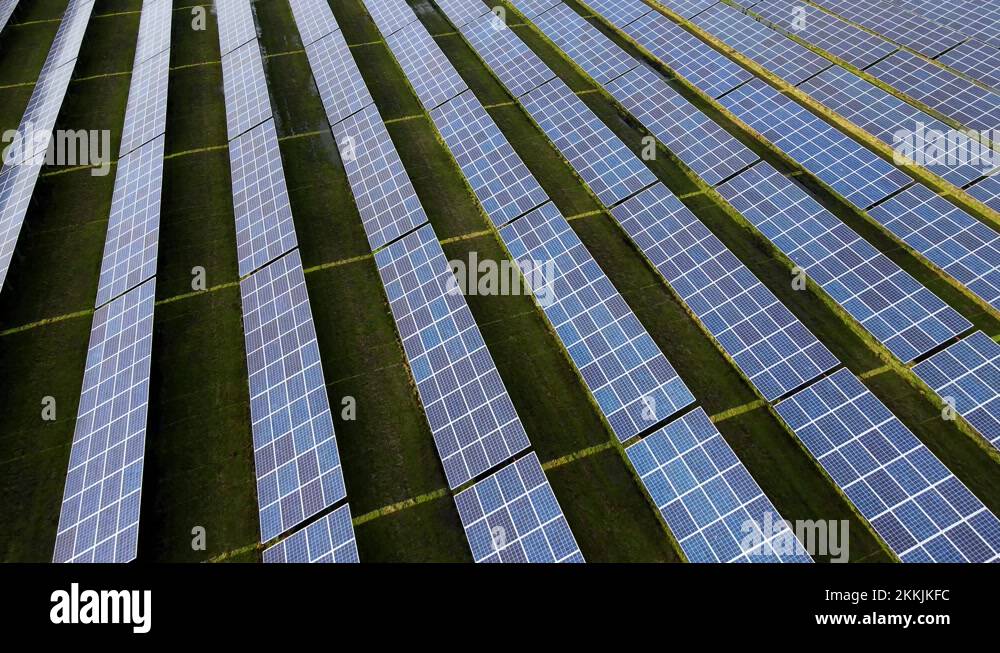 Solar panel park, an aerial drone view of multiple solar panels lined ...