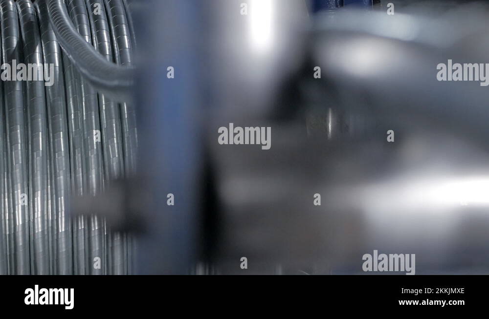 The winding of a high-voltage electrical cable in a metal shell. Plant ...