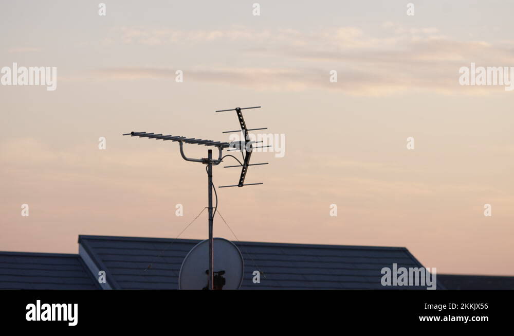 Yagi-Uda Antenna On The Roof Against Sunset Sky In Tokyo. static shot ...