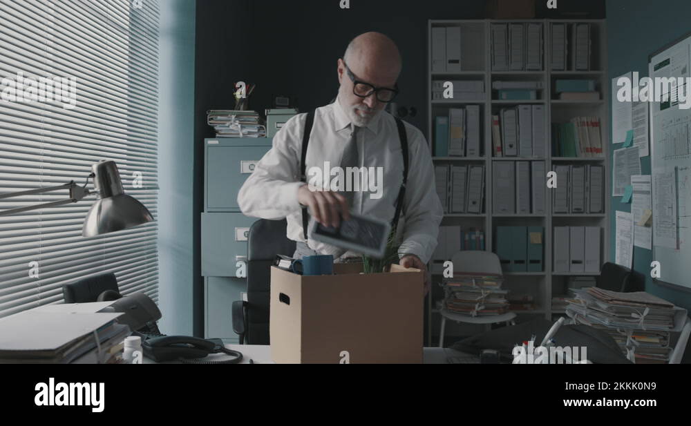 Employee packing his belongings and leaving the office Stock Video ...