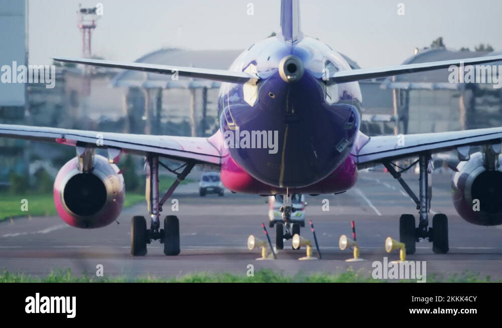 Airplane is taxiing on a taxiway to an airport terminal after landing ...
