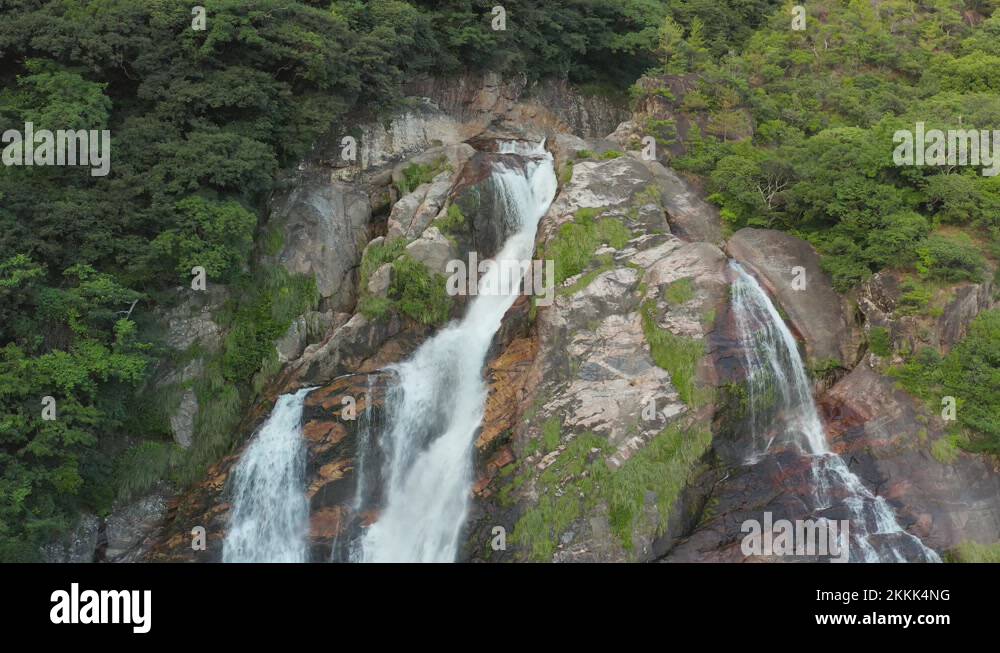 Oko Falls in Yakushima, Flowing over mountainside forest, Pan Shot ...