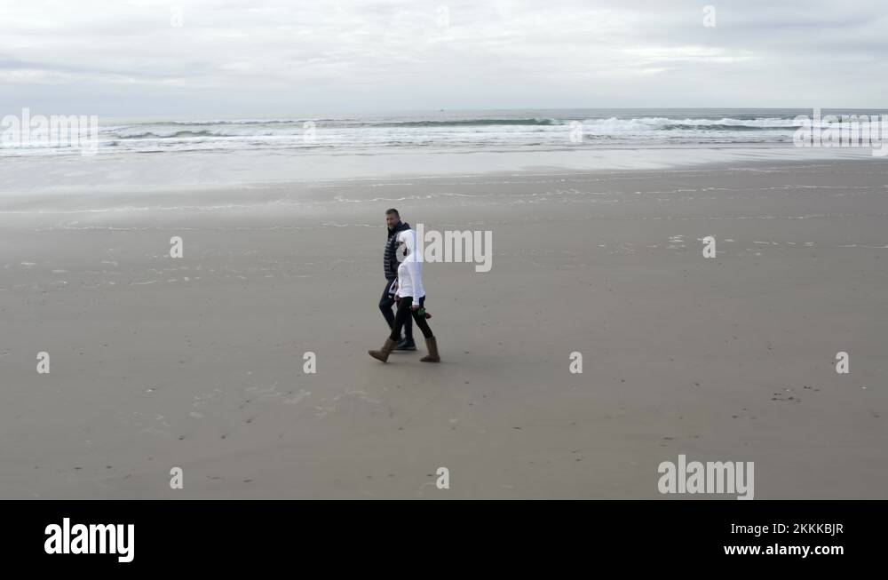 Women relaxing on cold beach Stock Videos & Footage - HD and 4K Video ...