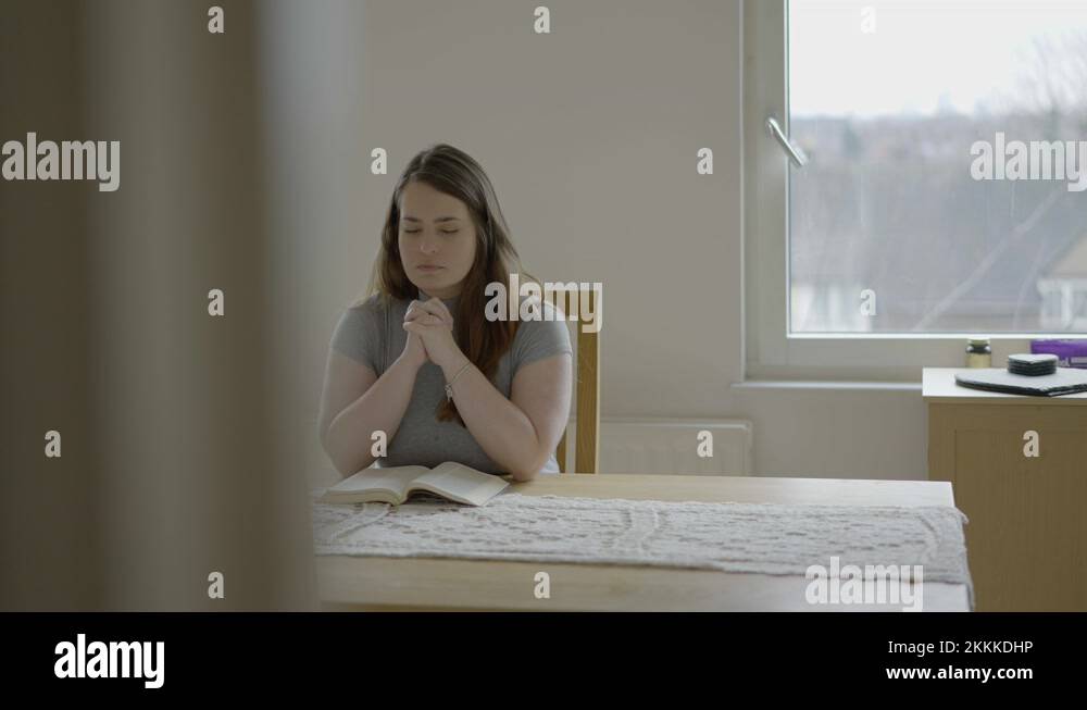 Woman praying alone Stock Videos & Footage - HD and 4K Video Clips - Alamy