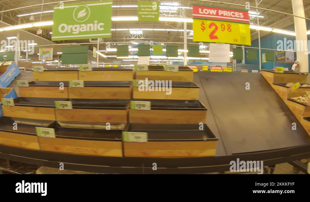 Mostly empty produce bins at the grocery store days after devastating ...