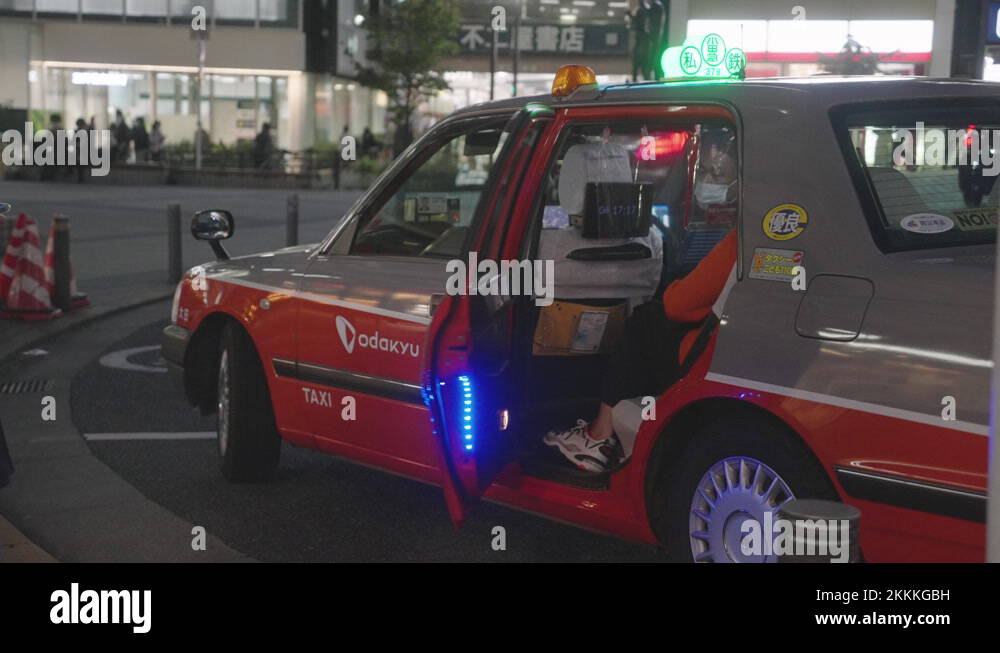 Man Getting On A Taxi And Leave At Night During Pandemic In Tokyo ...