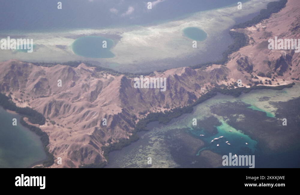 High Elevation Aerial: A Long Rocky and Hilly Island Surrounded by ...