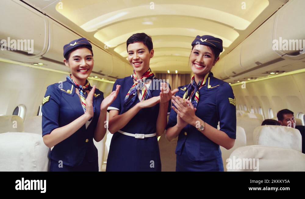 Cabin crew clapping hands in airplane Stock Video Footage - Alamy