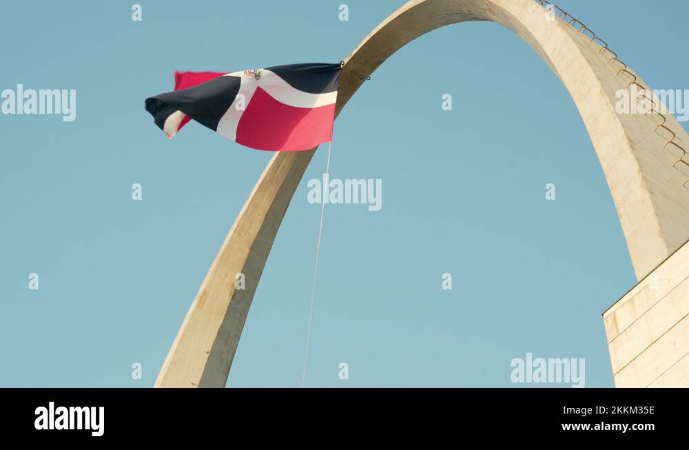 Dominican Republic flag waving over triumphal arch in plaza de la ...