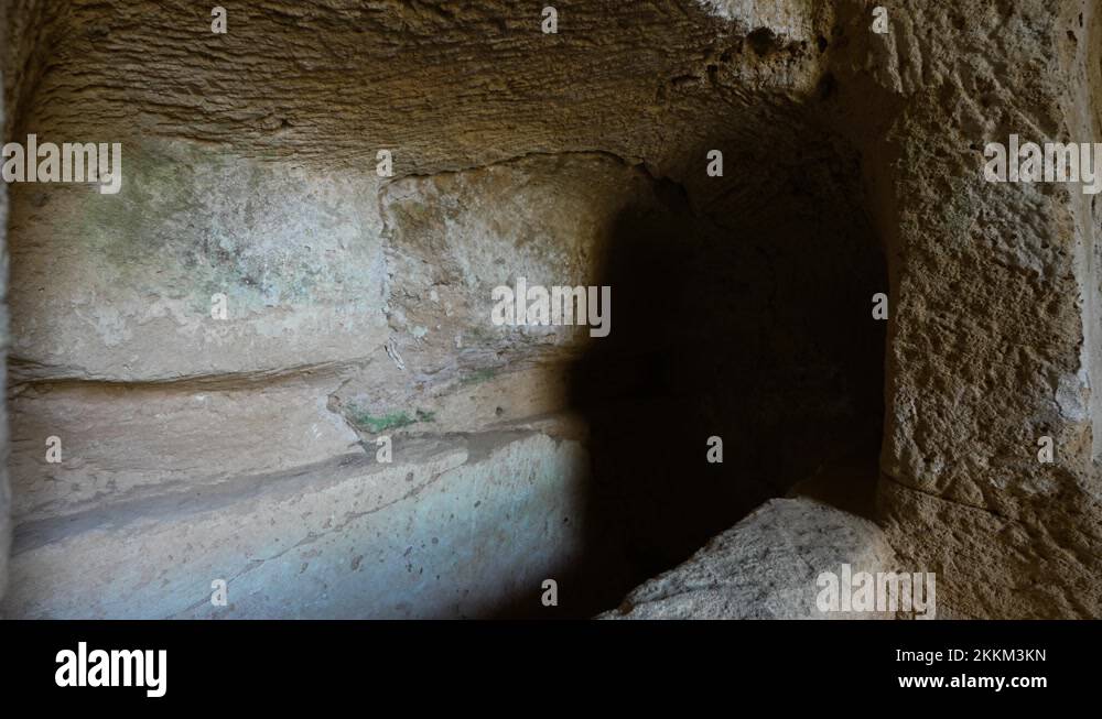 Close-up pullback of looking deep inside the dark burial chambers in ...