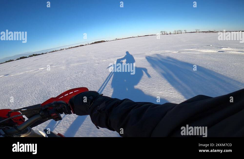 snowbike pov super slomo snow flying up behind rider as seen in sunset ...