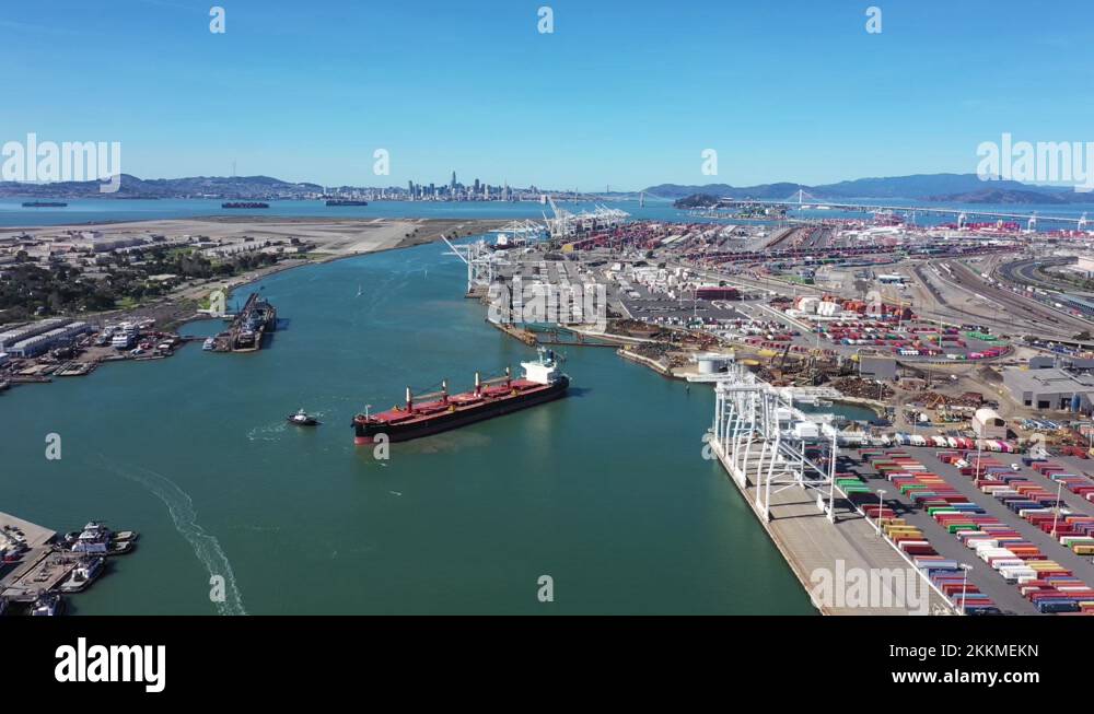 Container Ship being turned around by tug boats on the Oakland inner ...
