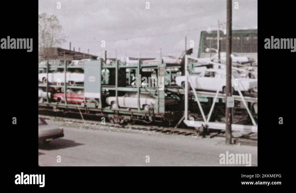 1960s: Map of Central Lowlands. Cars drive onto trailer. Workers ...