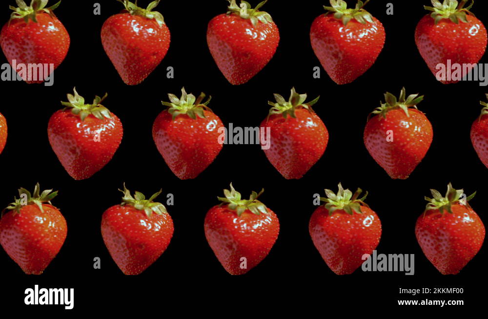 Real red floating spinning and rotating pattern of strawberries with ...