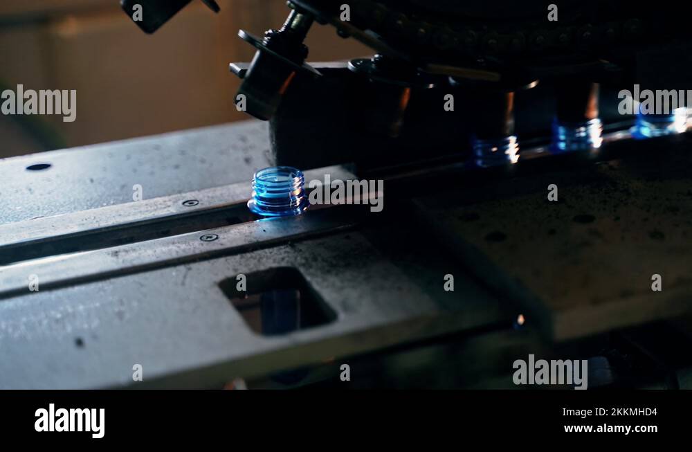 Inserting empty plastic bottle preforms into a conveyor belt Stock ... Inserting empty plastic bottle preforms into a conveyor belt Stock ...