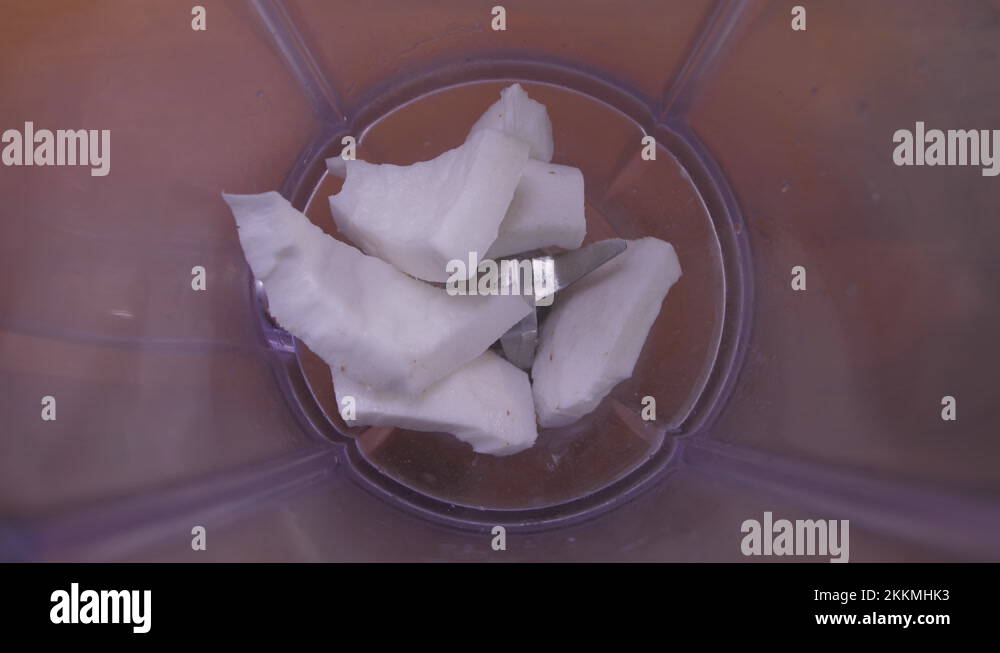 put sliced coconut into blender slow motion 4k Stock Video Footage - Alamy