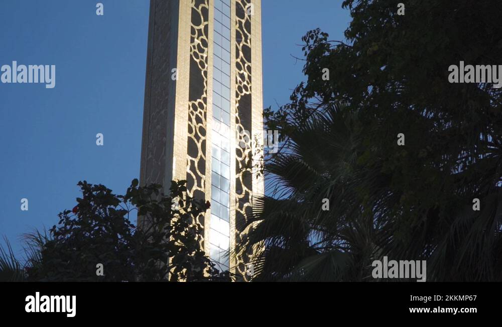 Sunlight Reflection On Glass Exterior Of Dubai Frame With Birds Flying ...