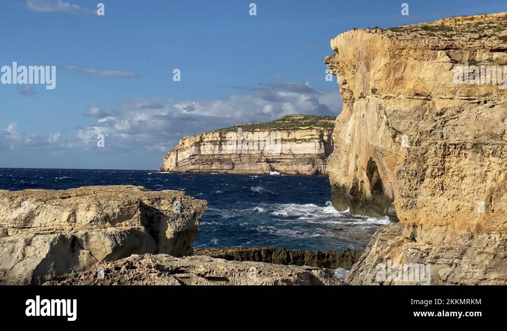 Waves crash limestone cliffs, Blue Hole, Gozo, site of former Azure ...