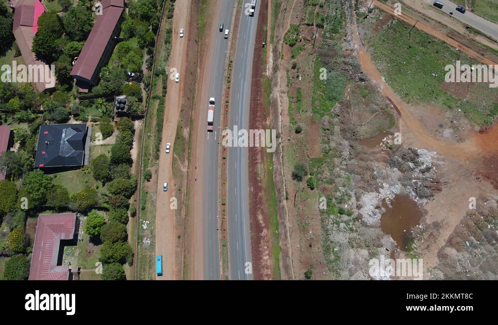 Traffic roads in the busy road of slums of Kibera kenya. Fast car ...