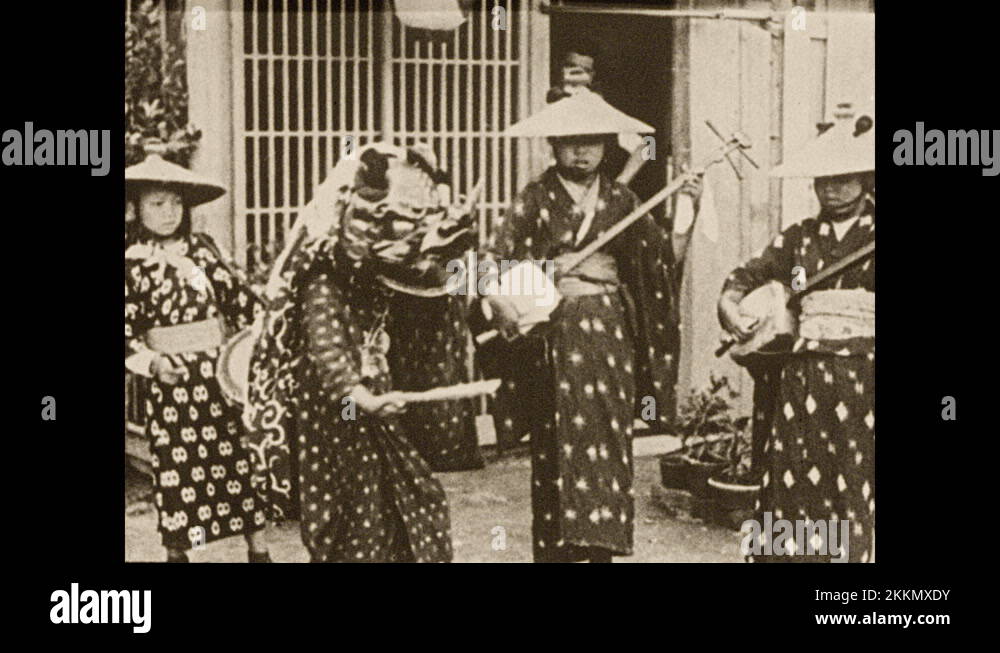 1930s: Children play instruments. Child dances in dragon mask Stock ...