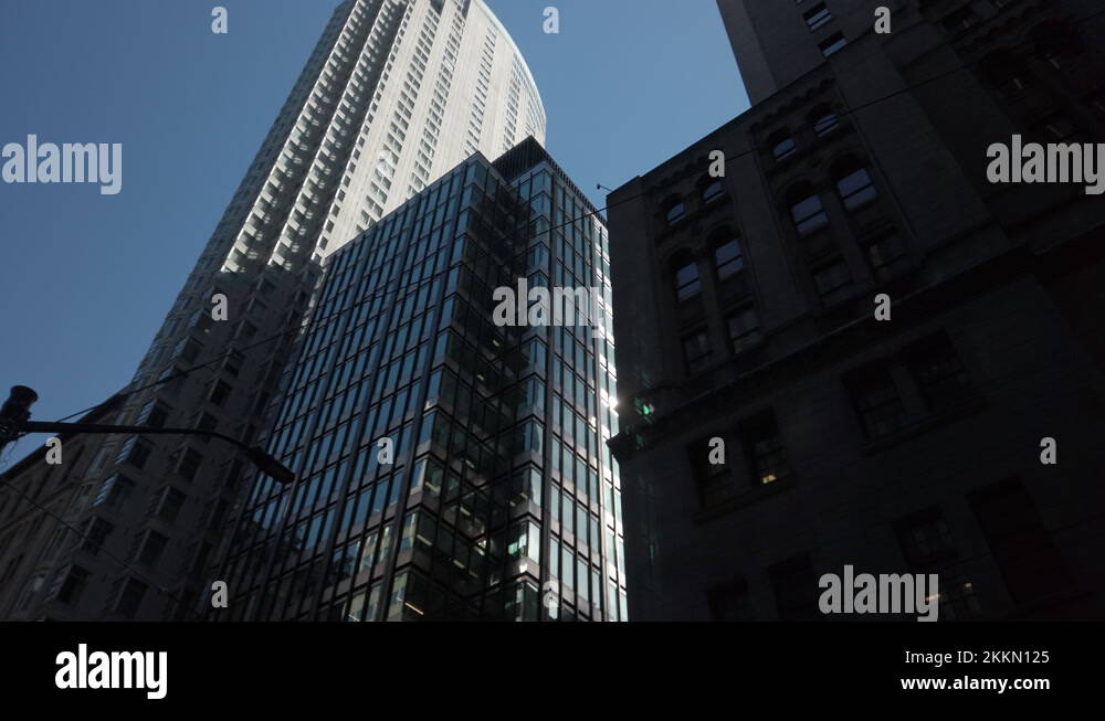 Wide panning shot revealing old and new architecture in downtown ...