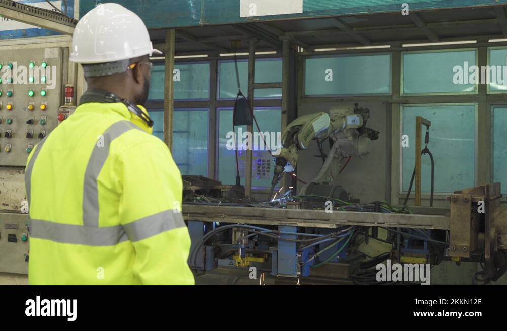 Black African American man, an engineer or worker control the smart ...