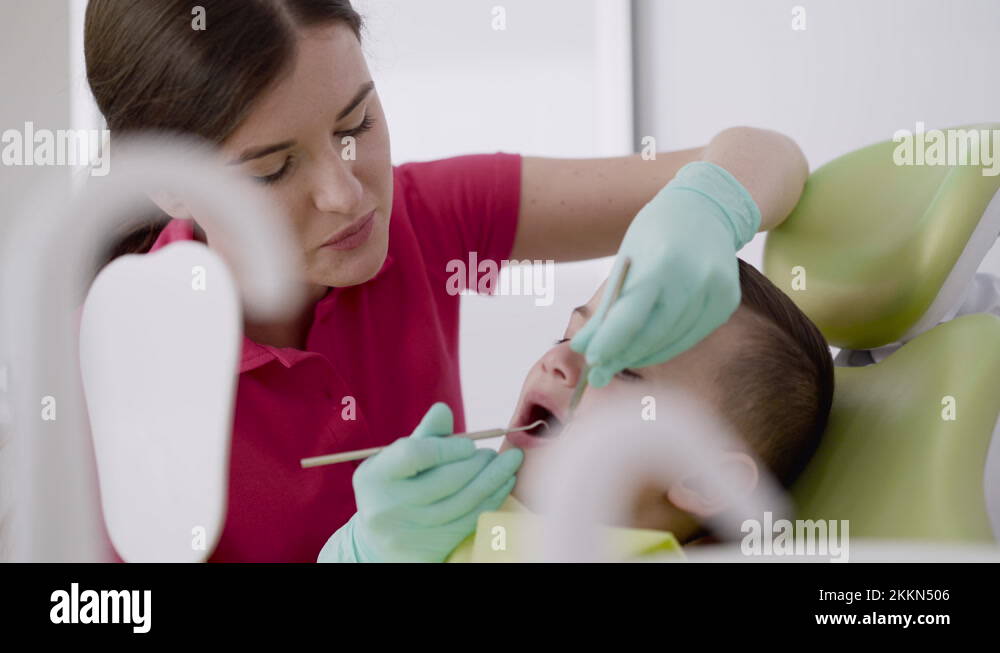 Close examination of child oral cavity during professional dental tooth ...