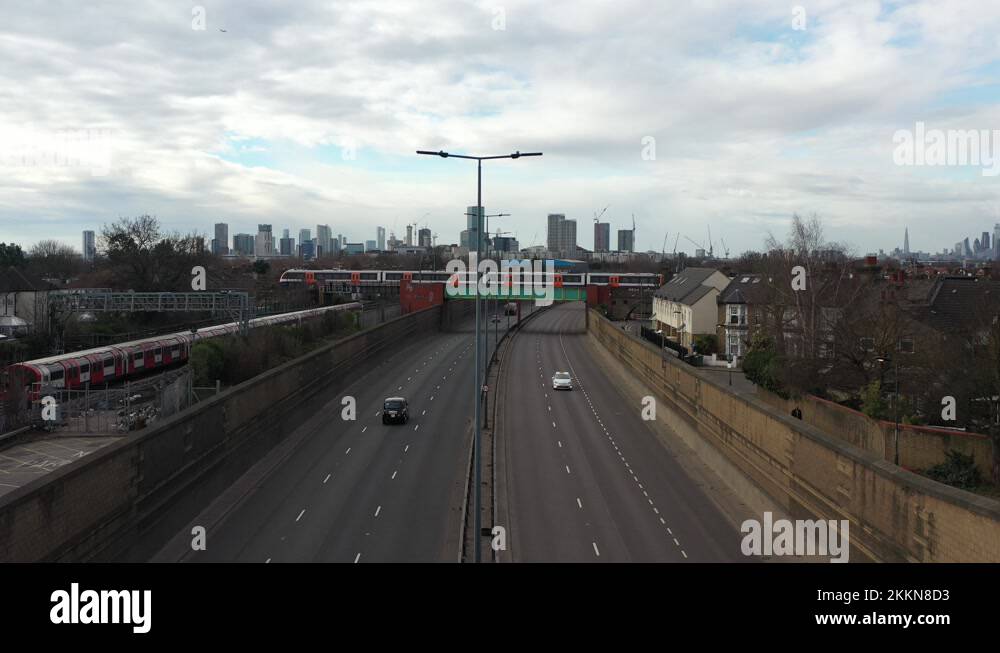 TRAINS CROSSING EACH OTHER OVER DUAL CARRIAGE HIGHWAY Stock Video ...
