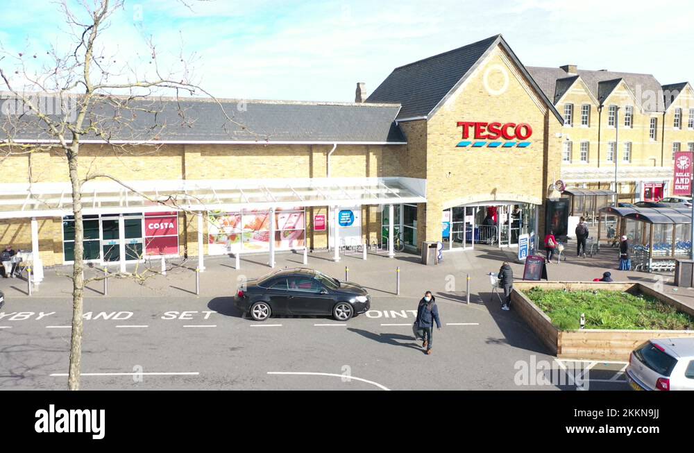 MAN PULLING A BAGGY AFTER SHOPPING AT TESCO SUPERMARKET Stock Video ...