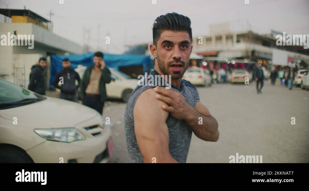 Portrait Of A Taxi Driver Showing His Muscles Near The Citadel in Erbil ...