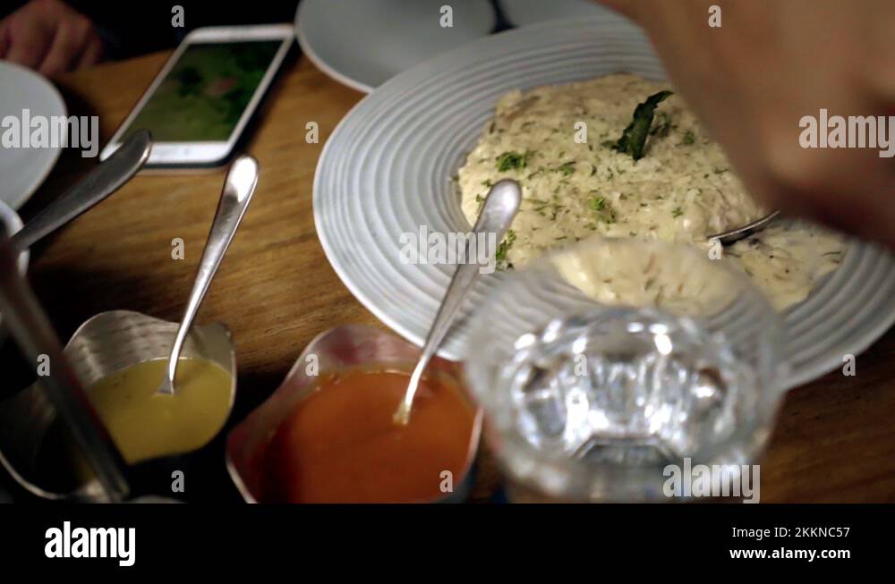 Close up Panning Shot of Hands Coming In, Grabbing Authentic Indian ...